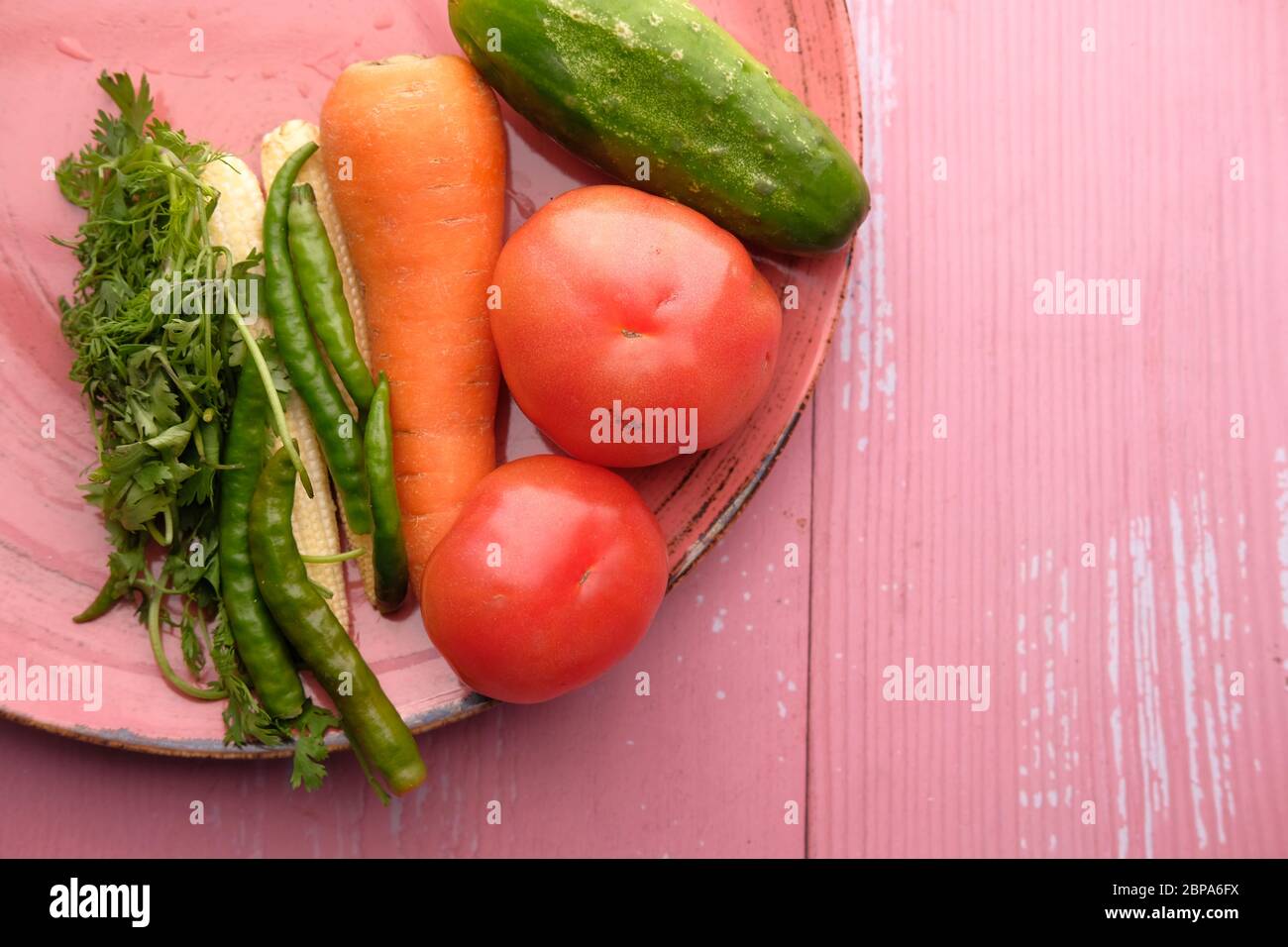 Healthy food selection with fresh vegetables on plate Stock Photo - Alamy