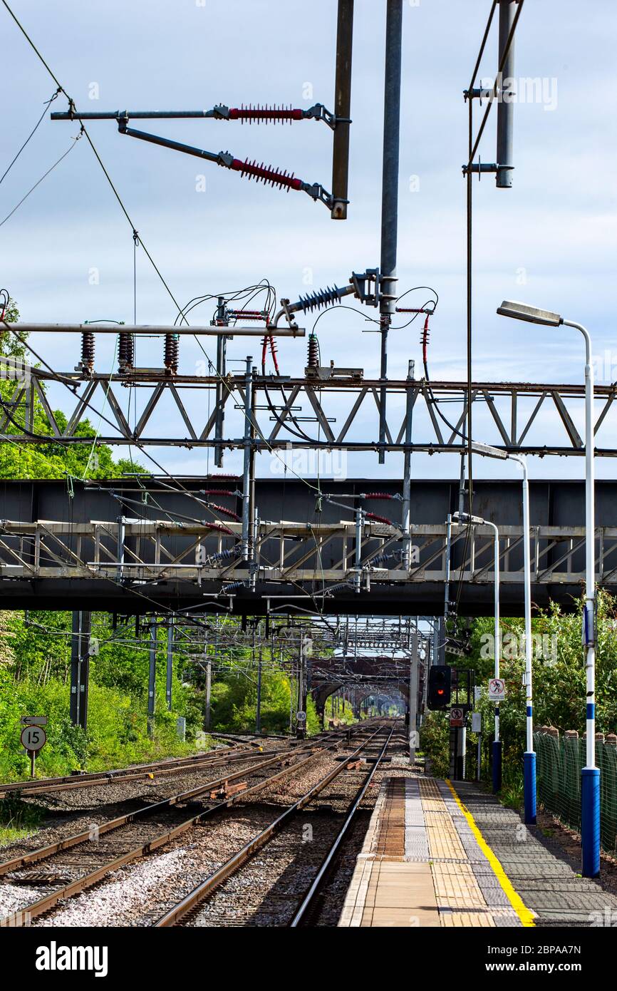 Railway tracks with overhead power cables UK Stock Photo - Alamy