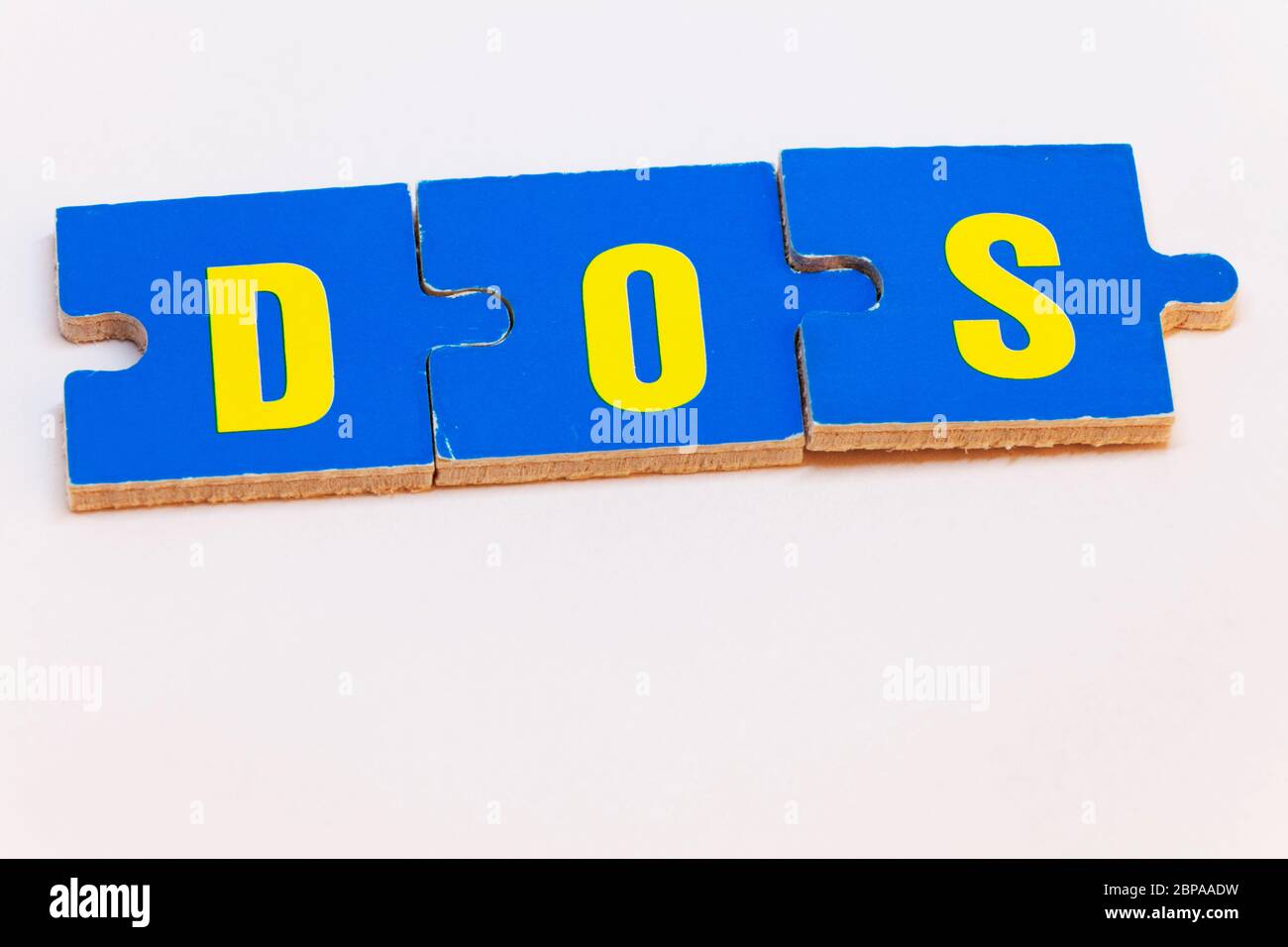 three puzzle pieces with the text dos Stock Photo - Alamy