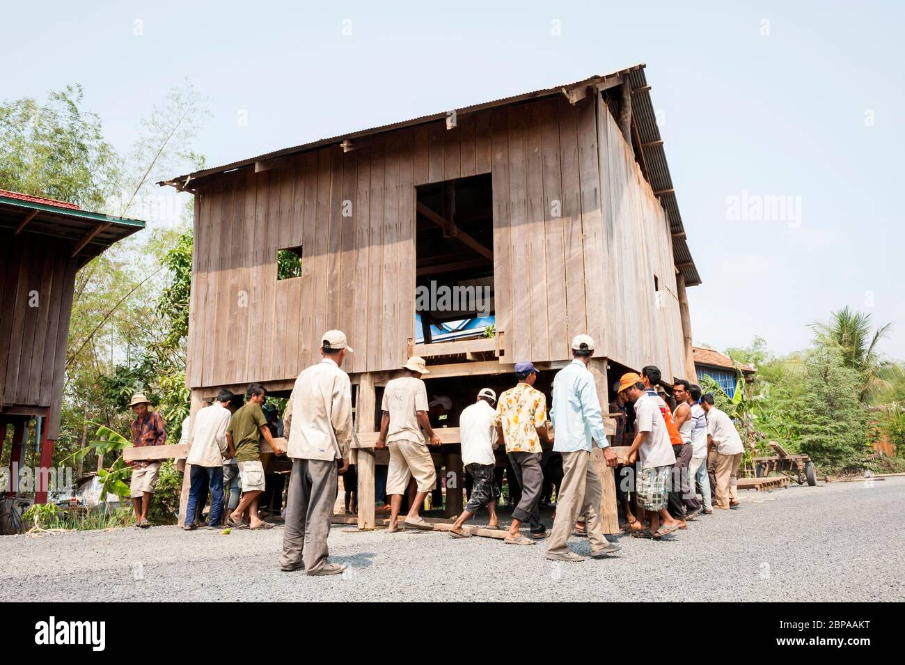 Men moving a house, Central Cambodia, Southeast Asia Stock Photo - Alamy