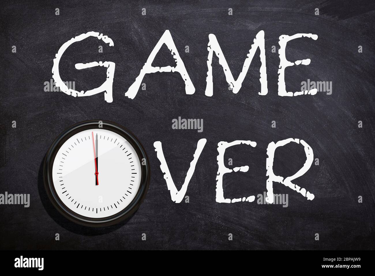 Game over handwritten text written with white chalk on chalkboard or ...