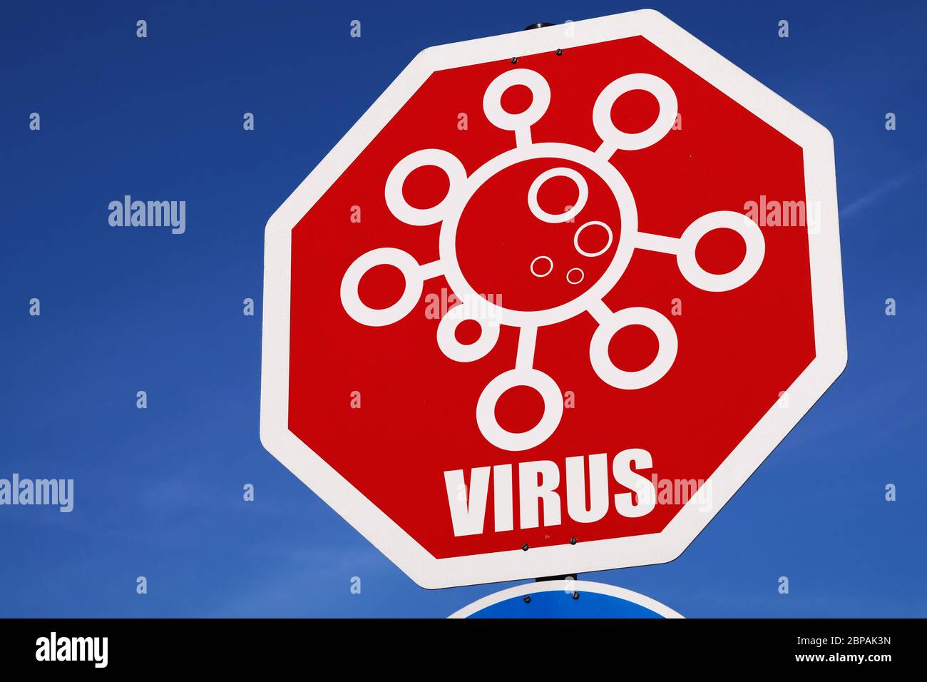 virus stop sign concept with blue sky background Stock Photo - Alamy