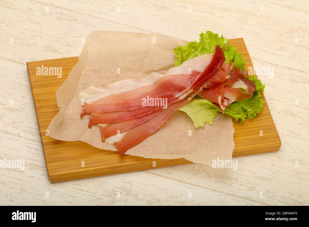 Spanish Hamon meat served salad leaves Stock Photo - Alamy
