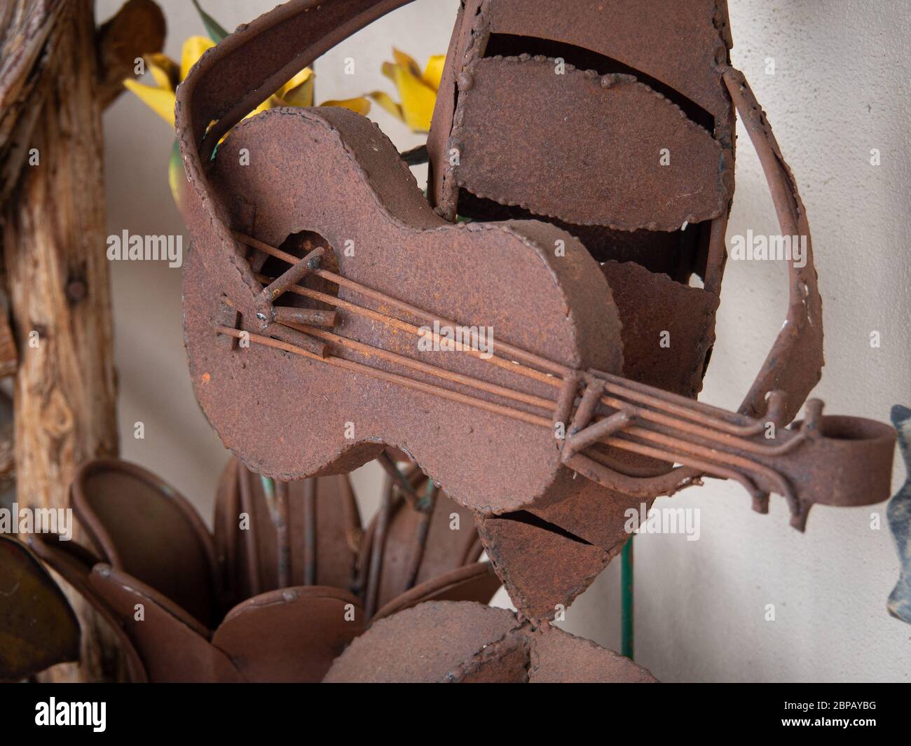 Closeup of metal statue playing guitar Stock Photo - Alamy