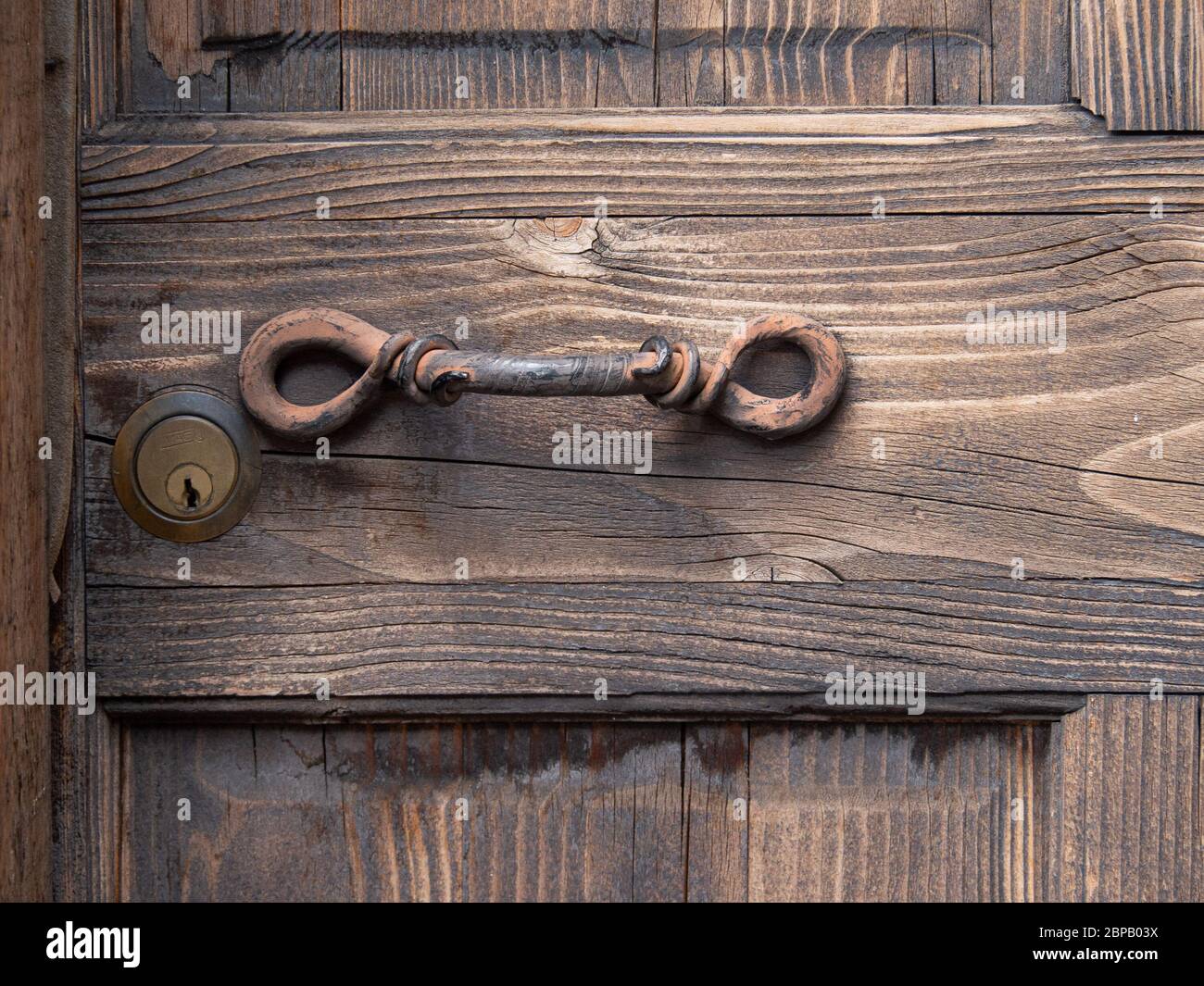 Old metal horizontal door handle Stock Photo - Alamy