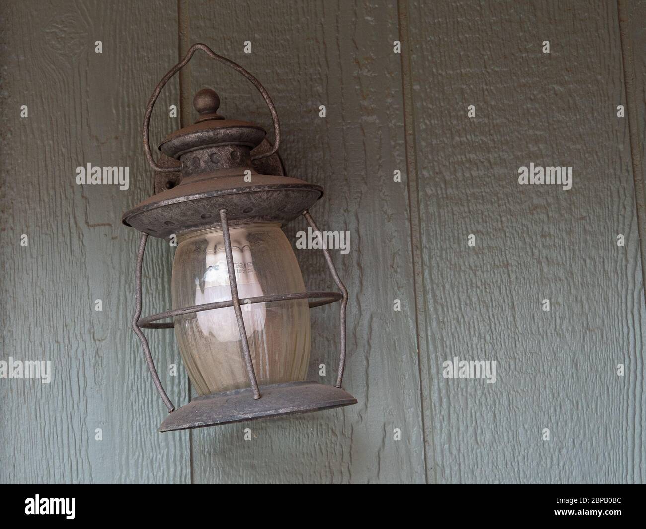 Antique gas light hanging on an outside wall Stock Photo - Alamy