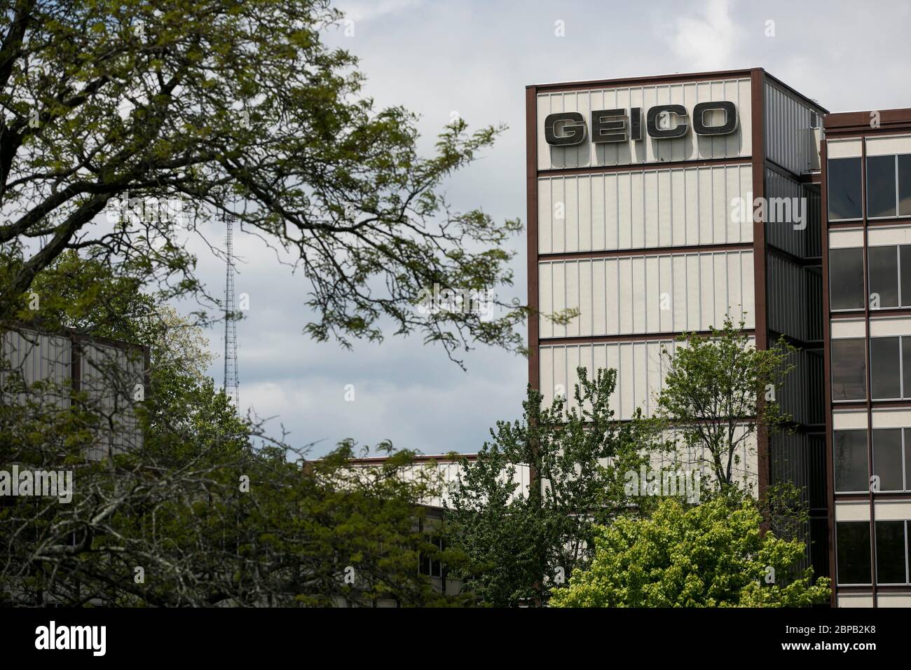 A logo sign outside of the headquarters of The Government Employees ...