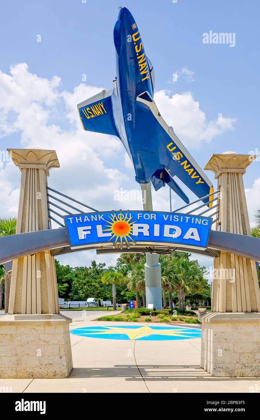 A welcome to Florida sign and a Grumman F-9 Cougar jet, one of the Blue ...