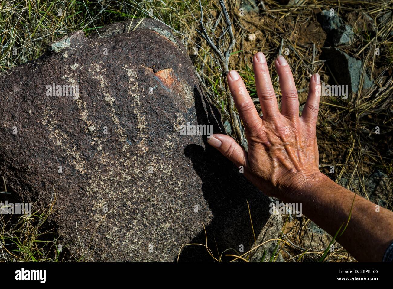 Rock art of and with a human hand created long ago by Jornada Mogollon ...
