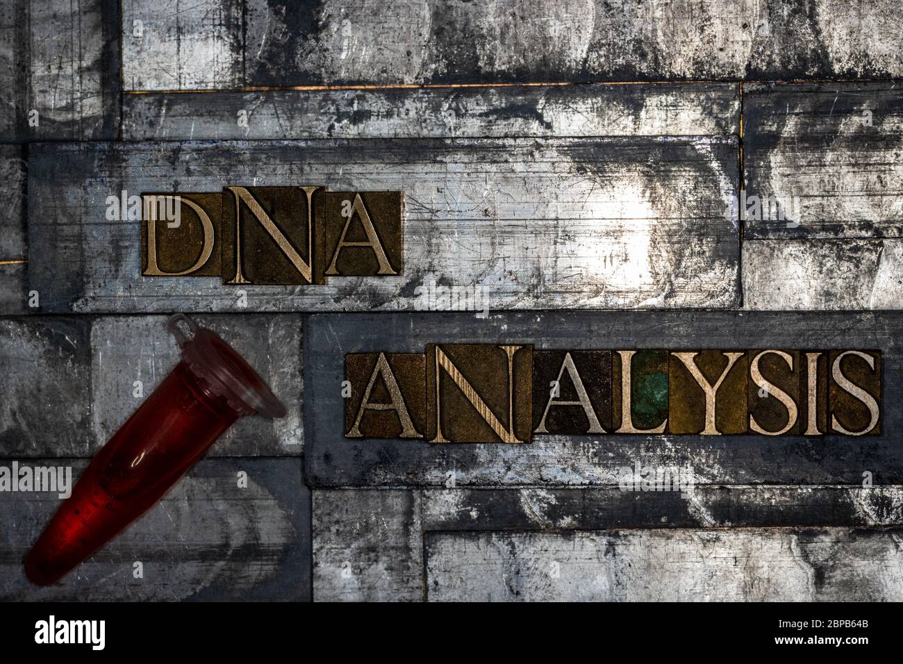 Photo of real authentic typeset letters forming DNA Analysis text with ...