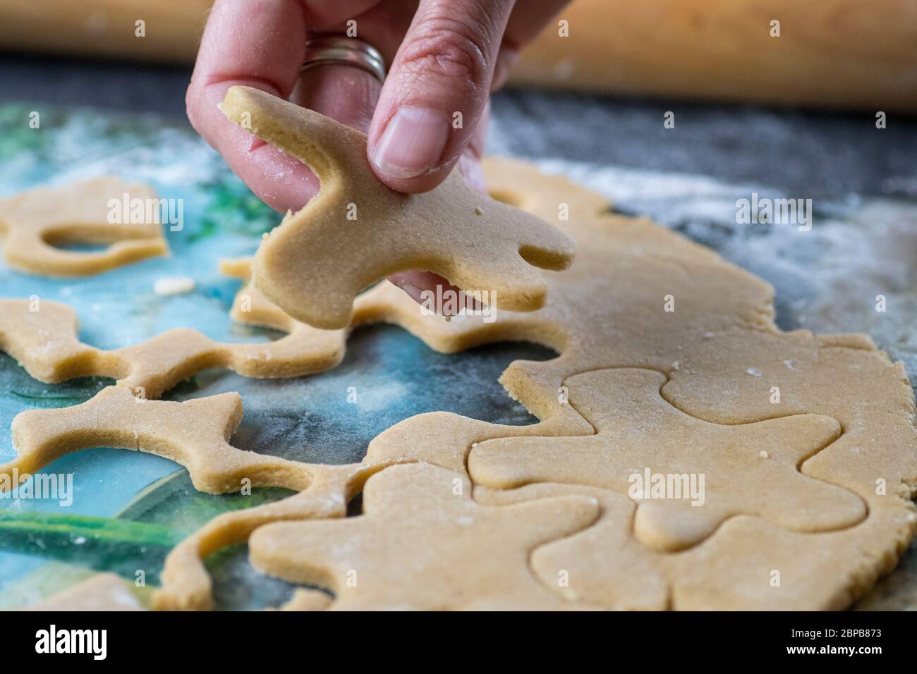Ginger bread men biscuits being made Stock Photo - Alamy