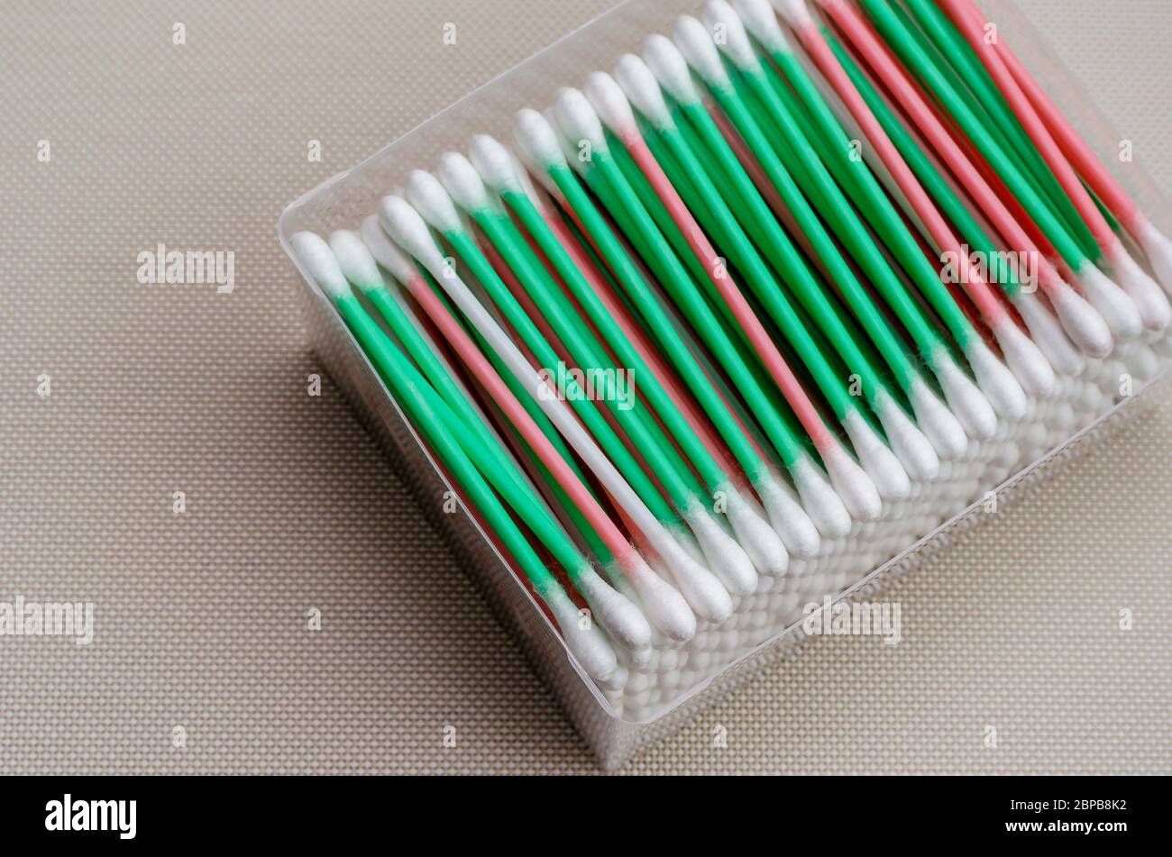 Set of cotton buds in a rectangular box. A plastic open box full of ...