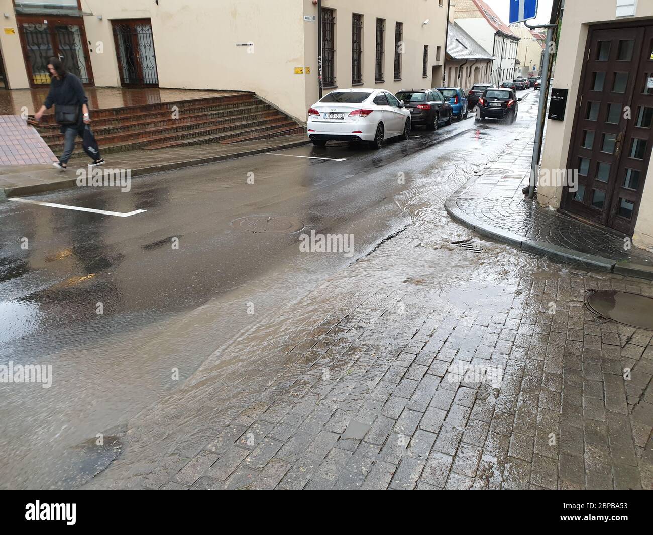 Street in the old town full of water during heavy rain Stock Photo - Alamy