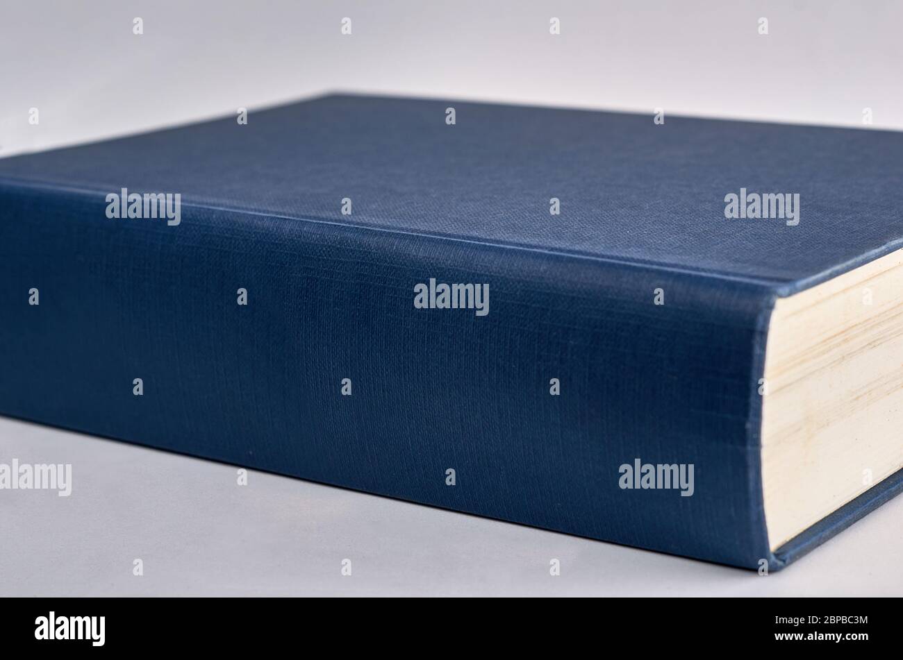 blue book on white background with copyspace Stock Photo - Alamy