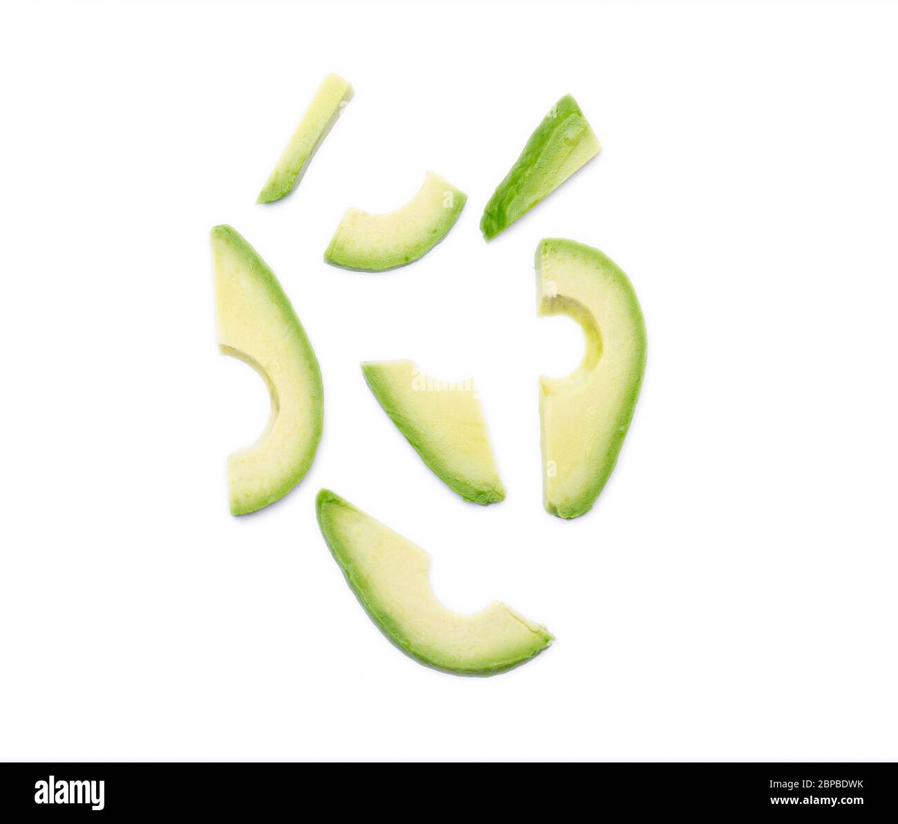 Set of raw green peeled avocado isolated on white background. Some ...