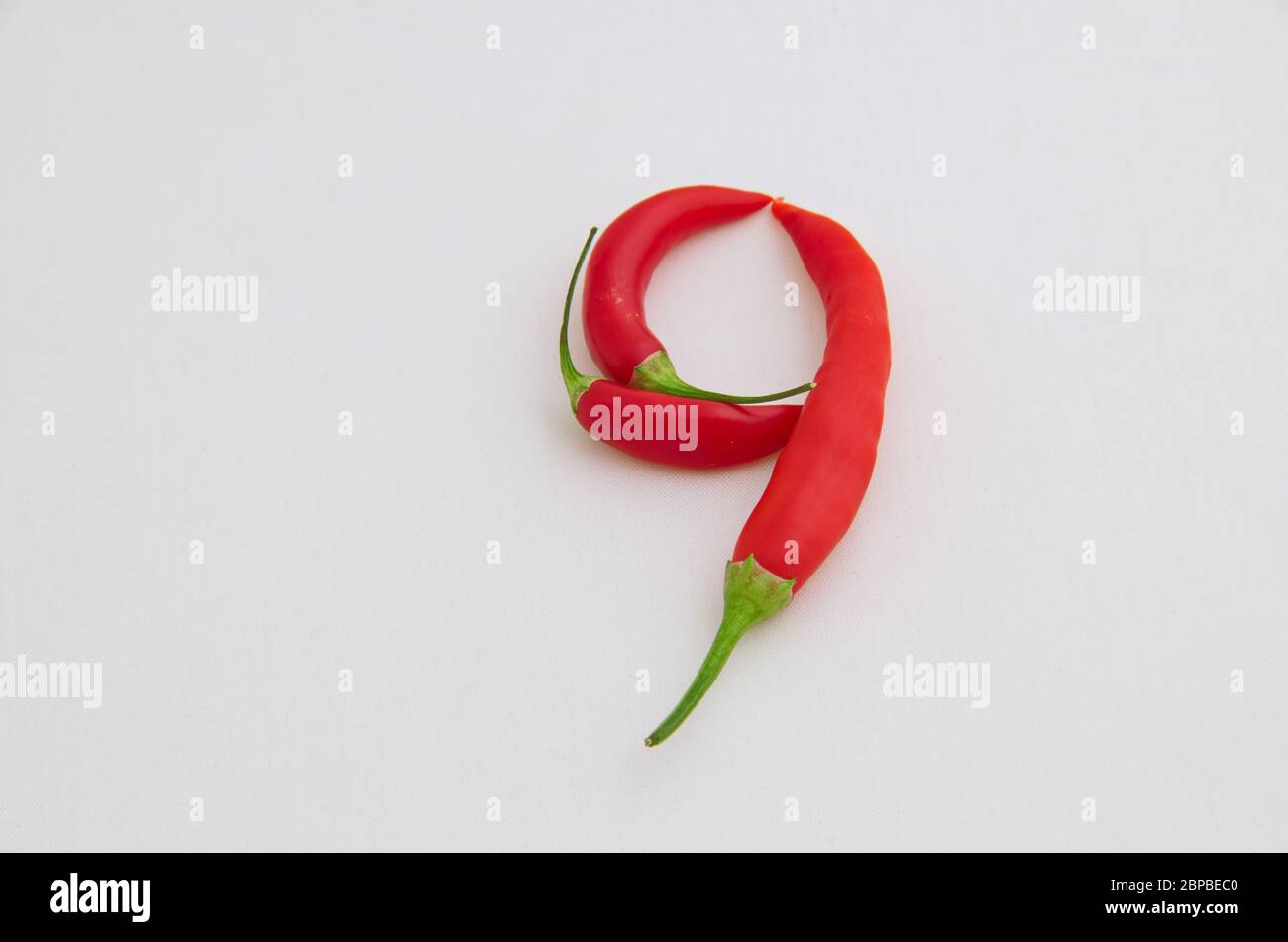 Sign 9, made from the fruit of fresh chilli red pepper with a green ...
