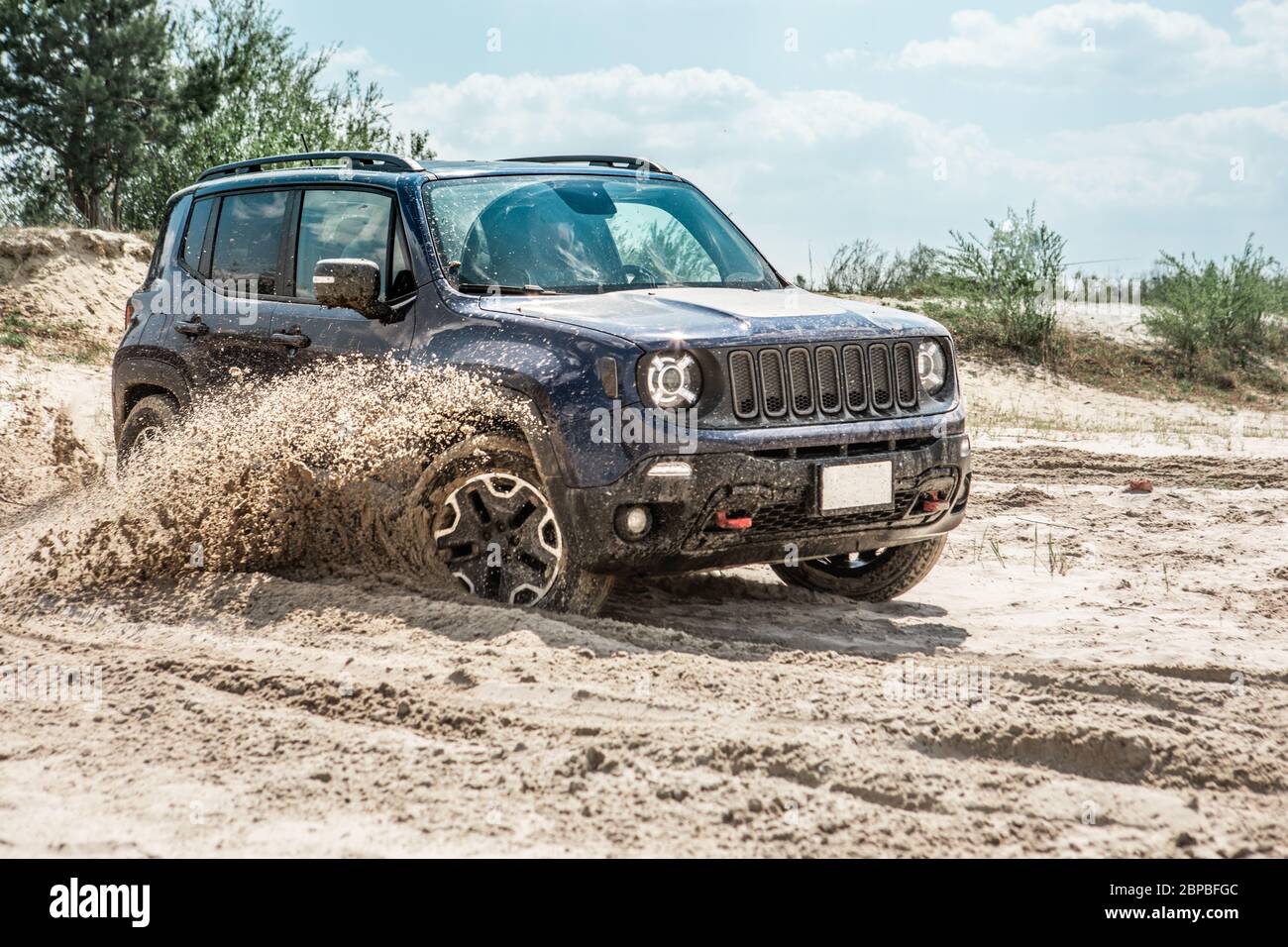man drifting doing donuts at sand beach Stock Photo - Alamy