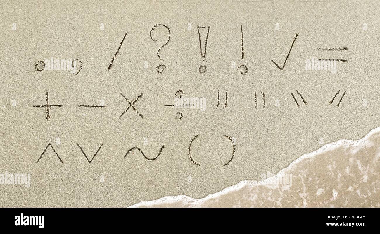 Punctuation mark handwritten in the sand on the beach Stock Photo - Alamy