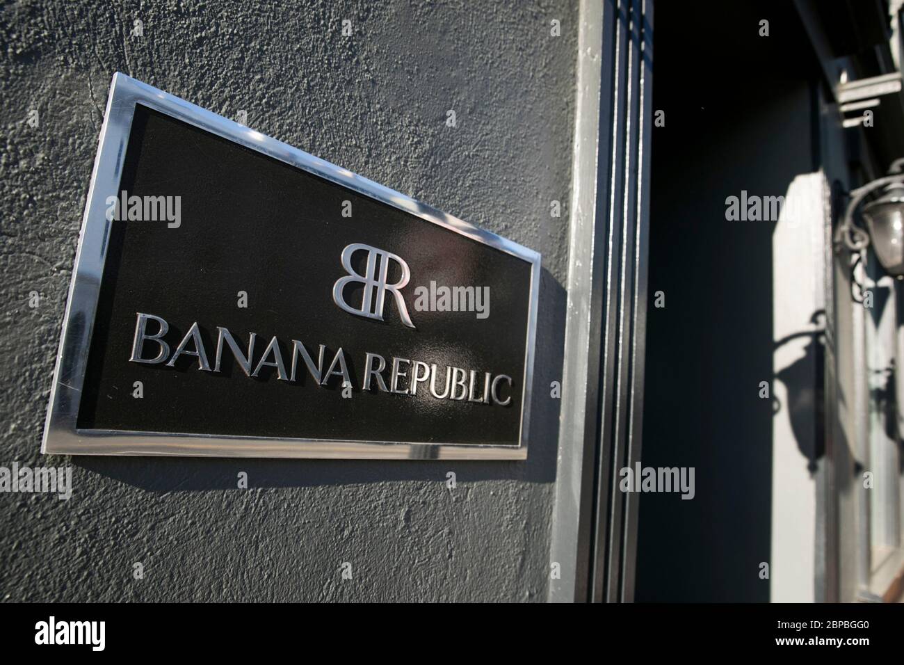 A logo sign outside of a Banana Republic retail store location in ...