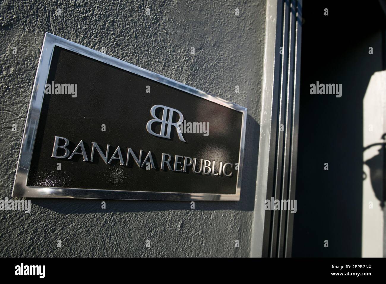 A logo sign outside of a Banana Republic retail store location in ...