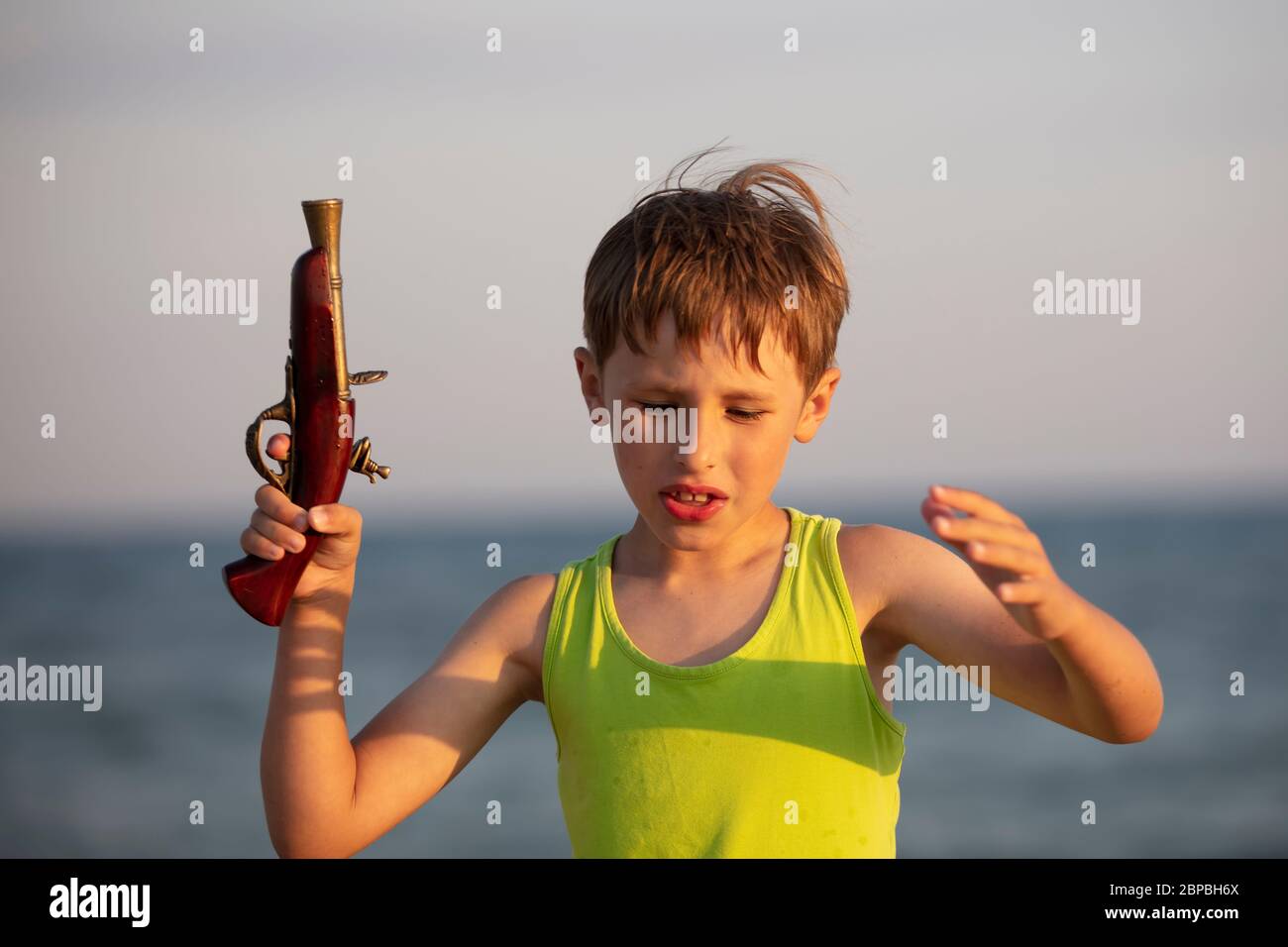 Black child with toy gun hi-res stock photography and images - Alamy