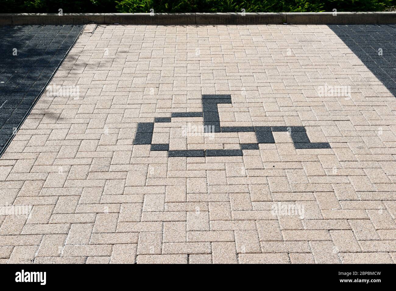 Block pavement stones used for road way and parking spaces with black ...