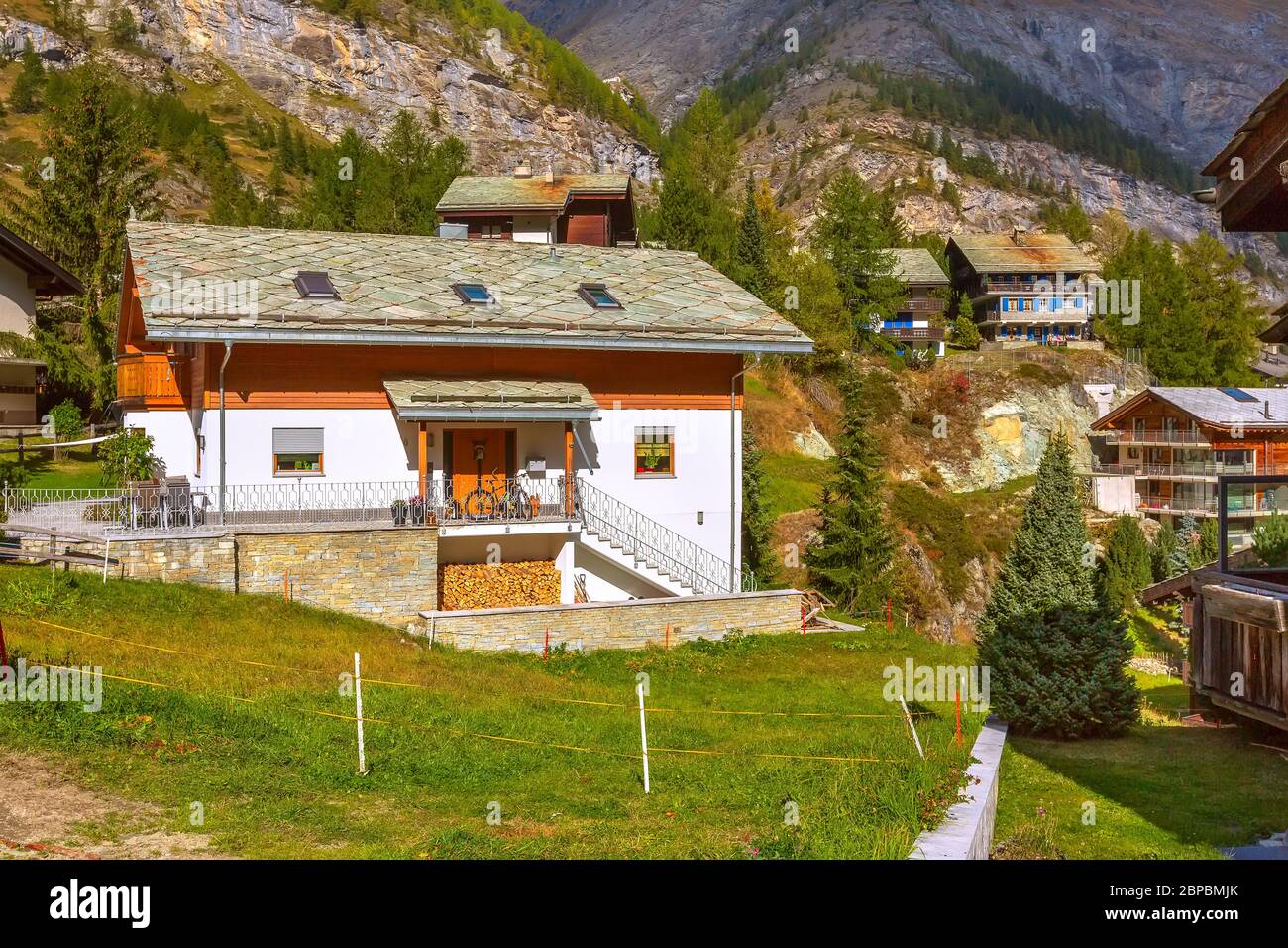 Zermatt, alpine village, Switzerland, Swiss Alps, houses and green pine ...