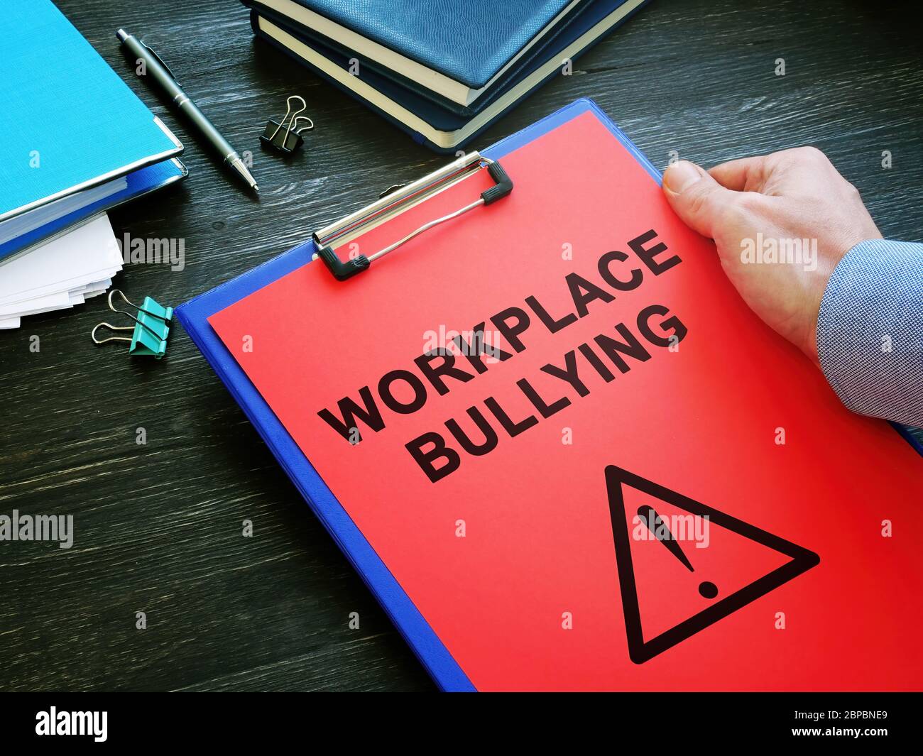 Workplace Bullying complain papers on the office desk Stock Photo - Alamy