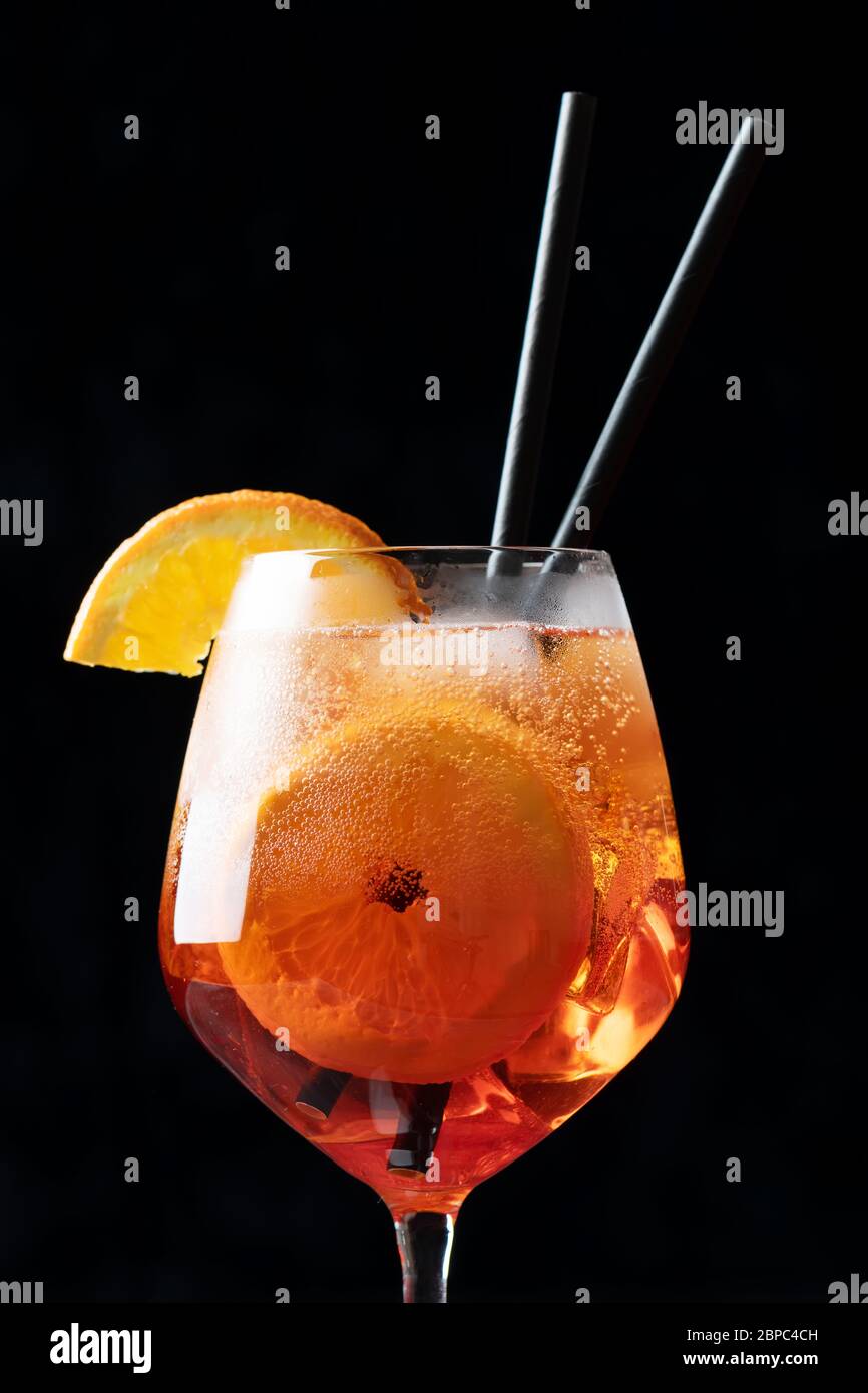 Classic italian aperol spritz cocktail in glass on black, close up ...