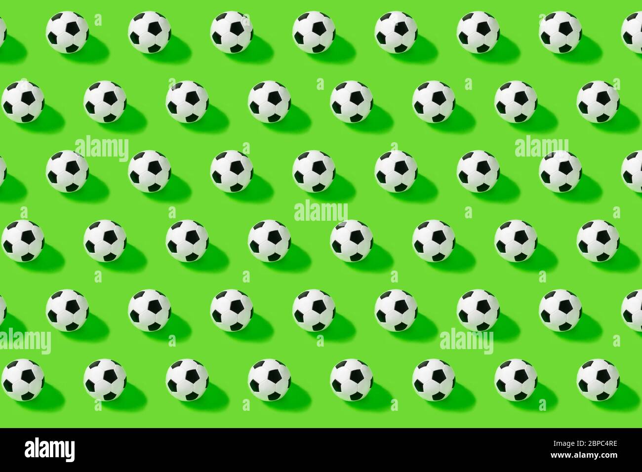 Pattern. Soccer ball on green backgraund. place for text. Game, match ...