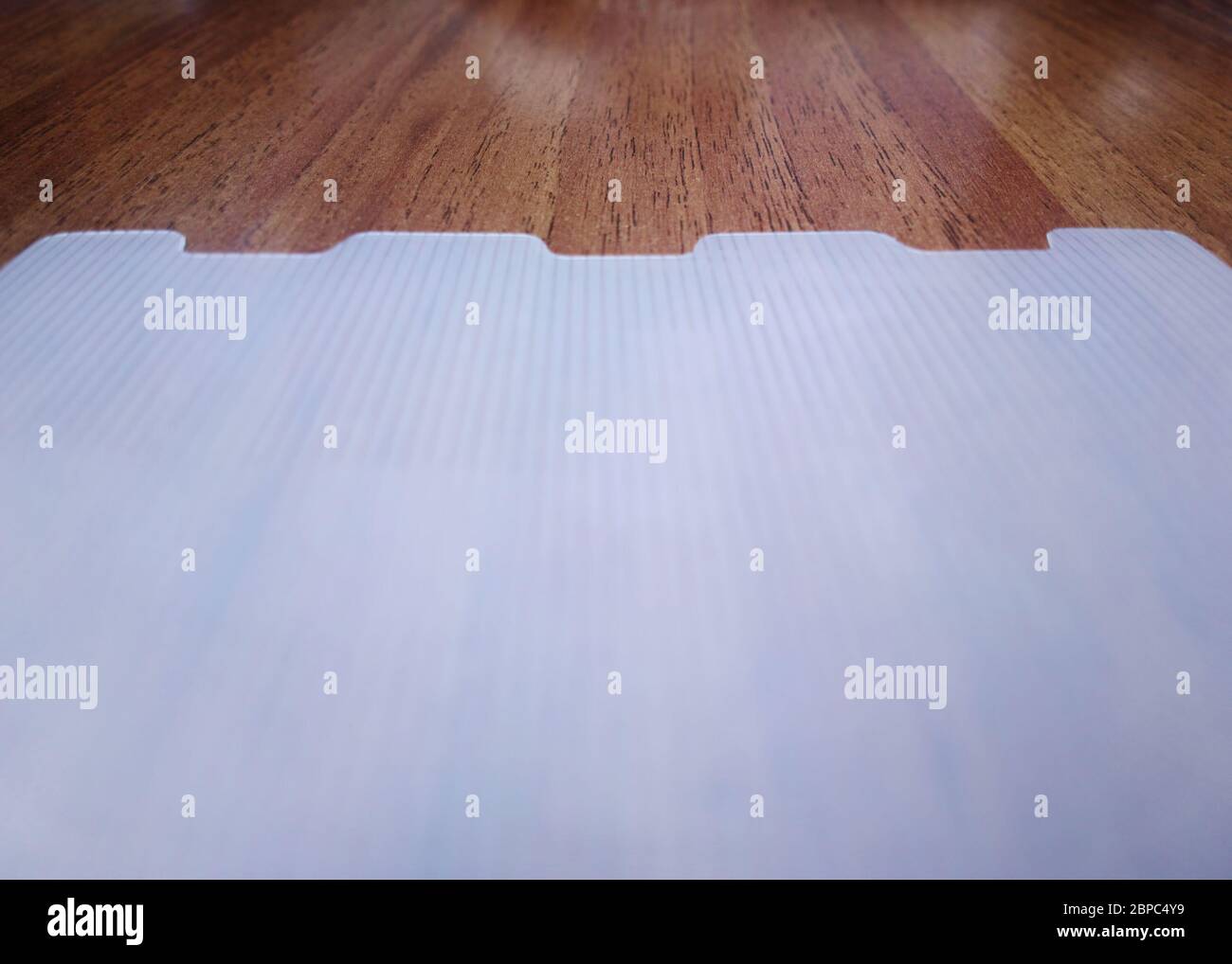 Wooden table covered with white folder office background Stock Photo ...