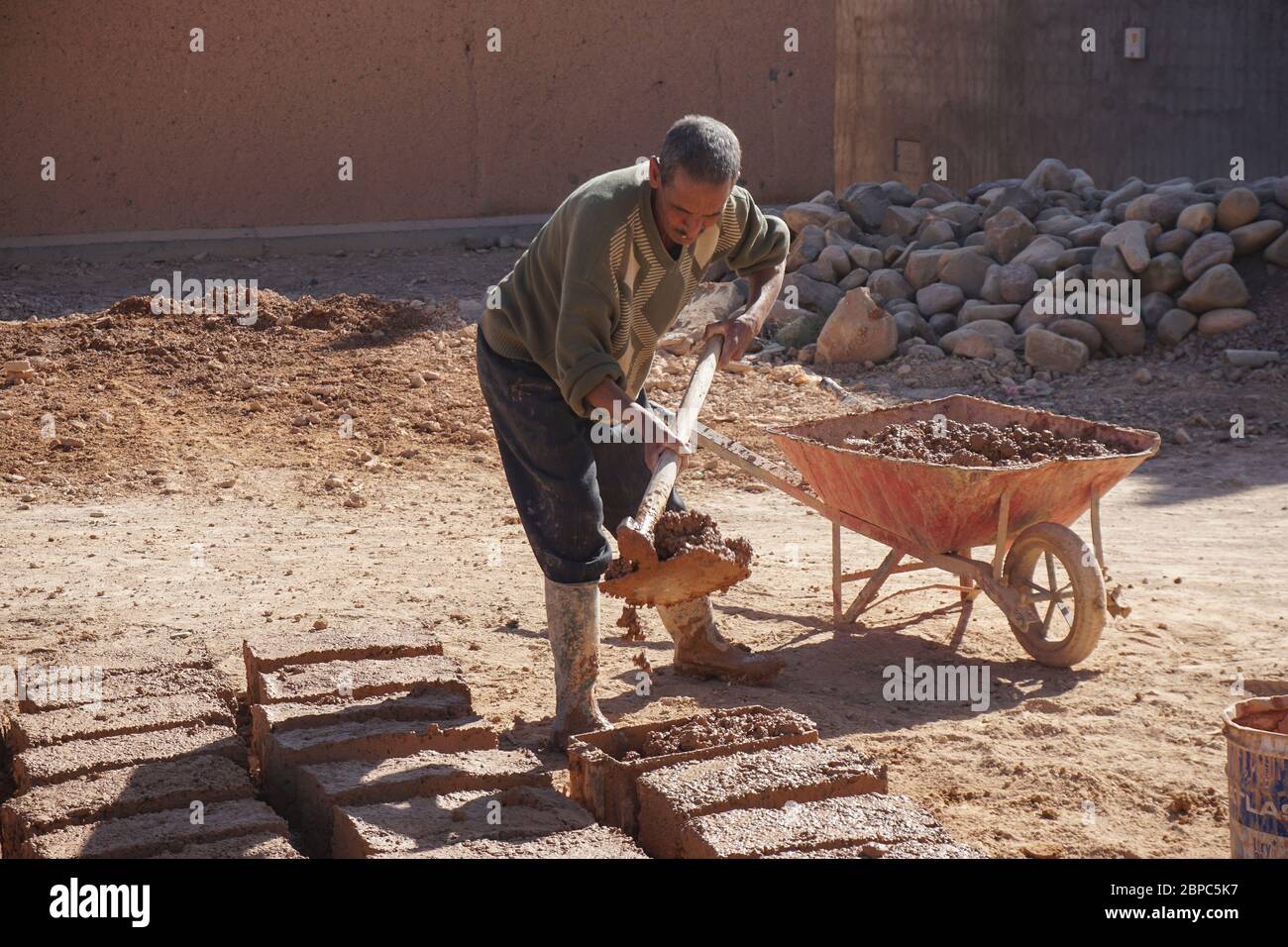 making of adobe bricks in N`Kob in Draa Valley, southern Morocco Stock ...