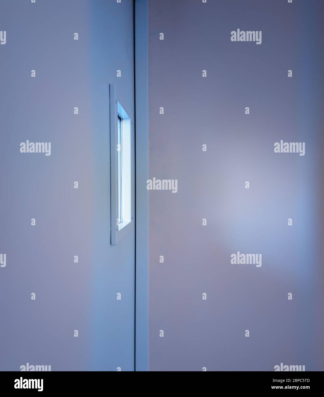Dramatic light leak coming through closed door background Stock Photo ...
