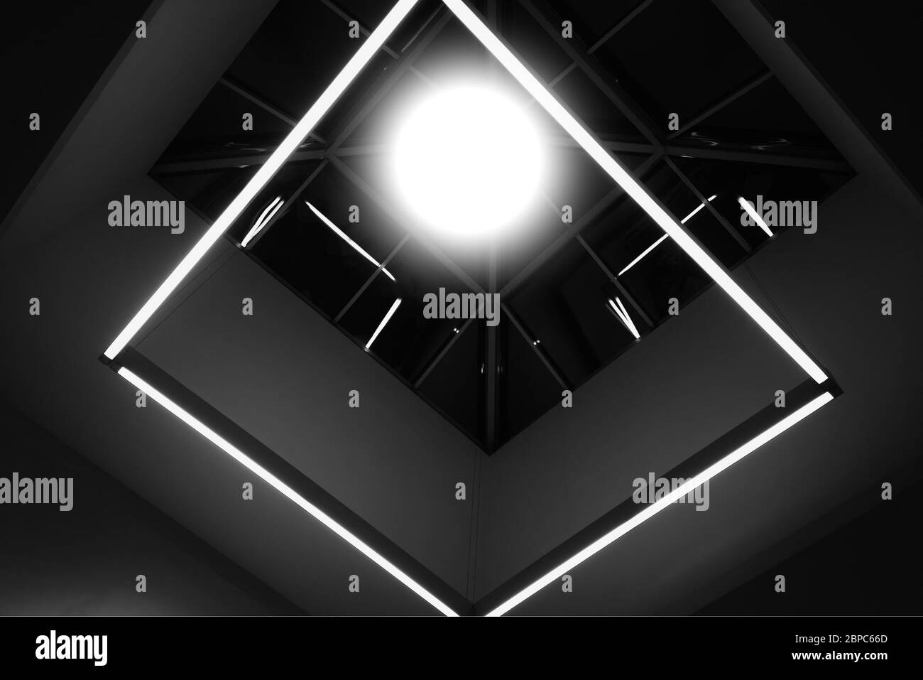 Black and white framework with glowing lamp background Stock Photo - Alamy