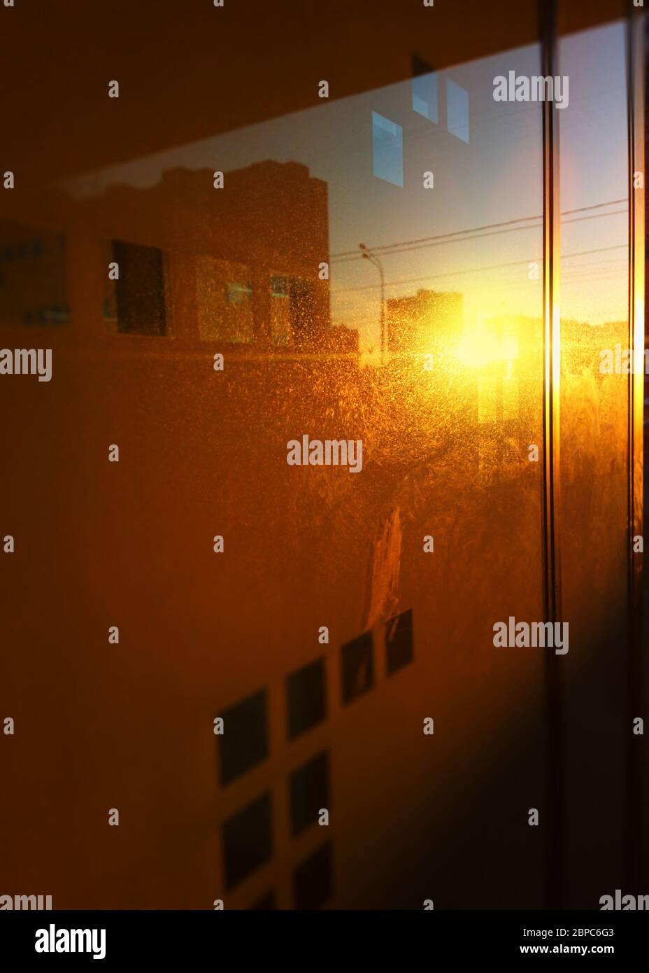 Sun flare reflection on dirty window glass Stock Photo - Alamy