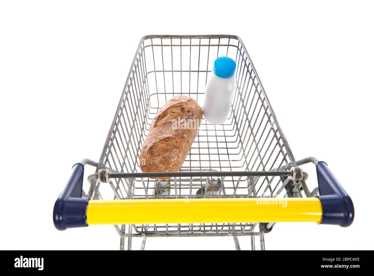 shopping cart blue and yellow with basics as bread and milk Stock Photo ...