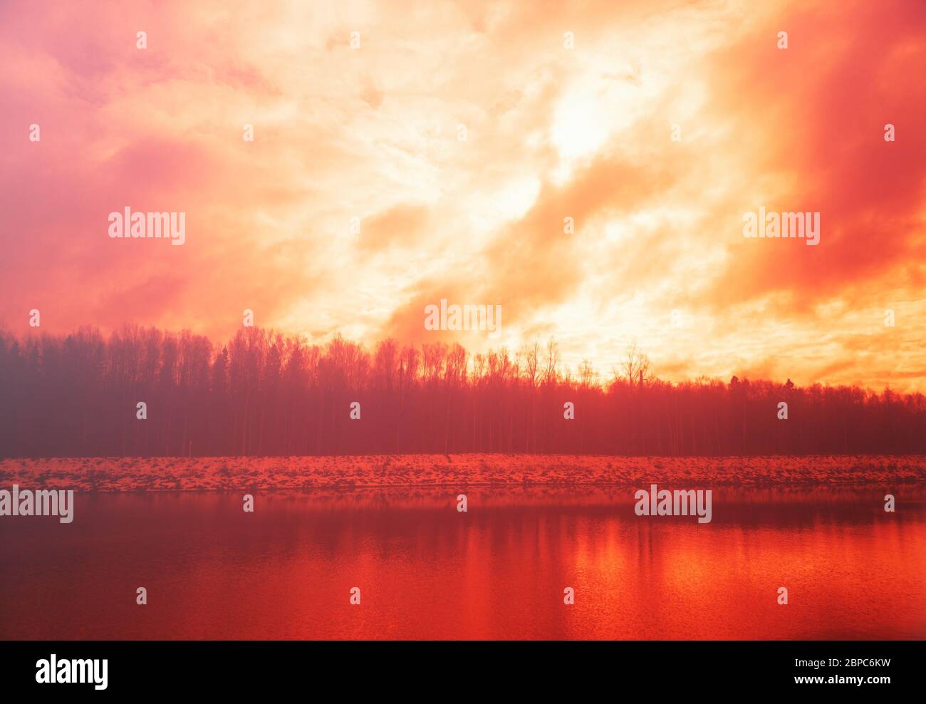 Burning sunset on winter river background Stock Photo - Alamy
