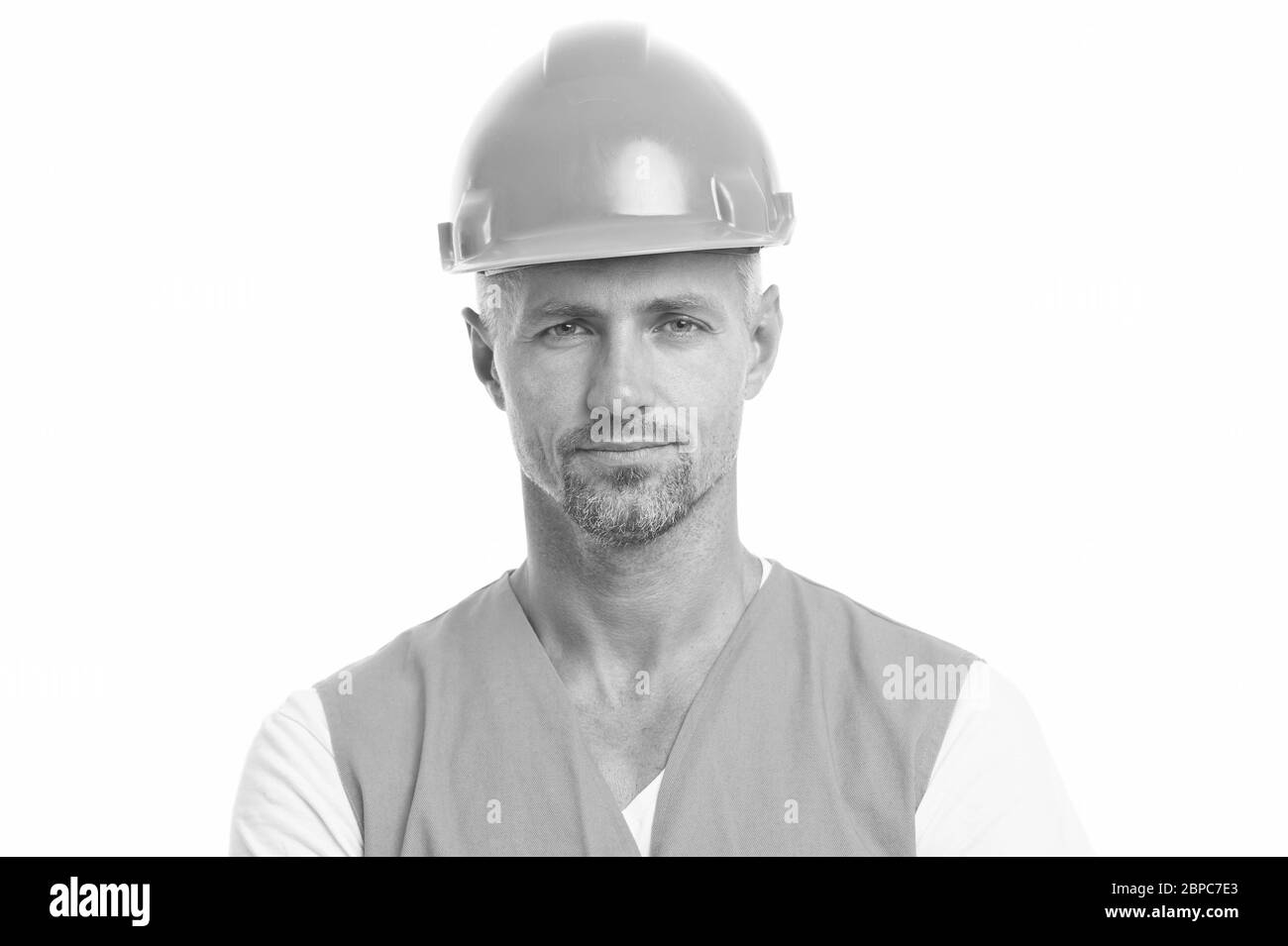 man in helmet. wear construction helmet on building site. Builders ...