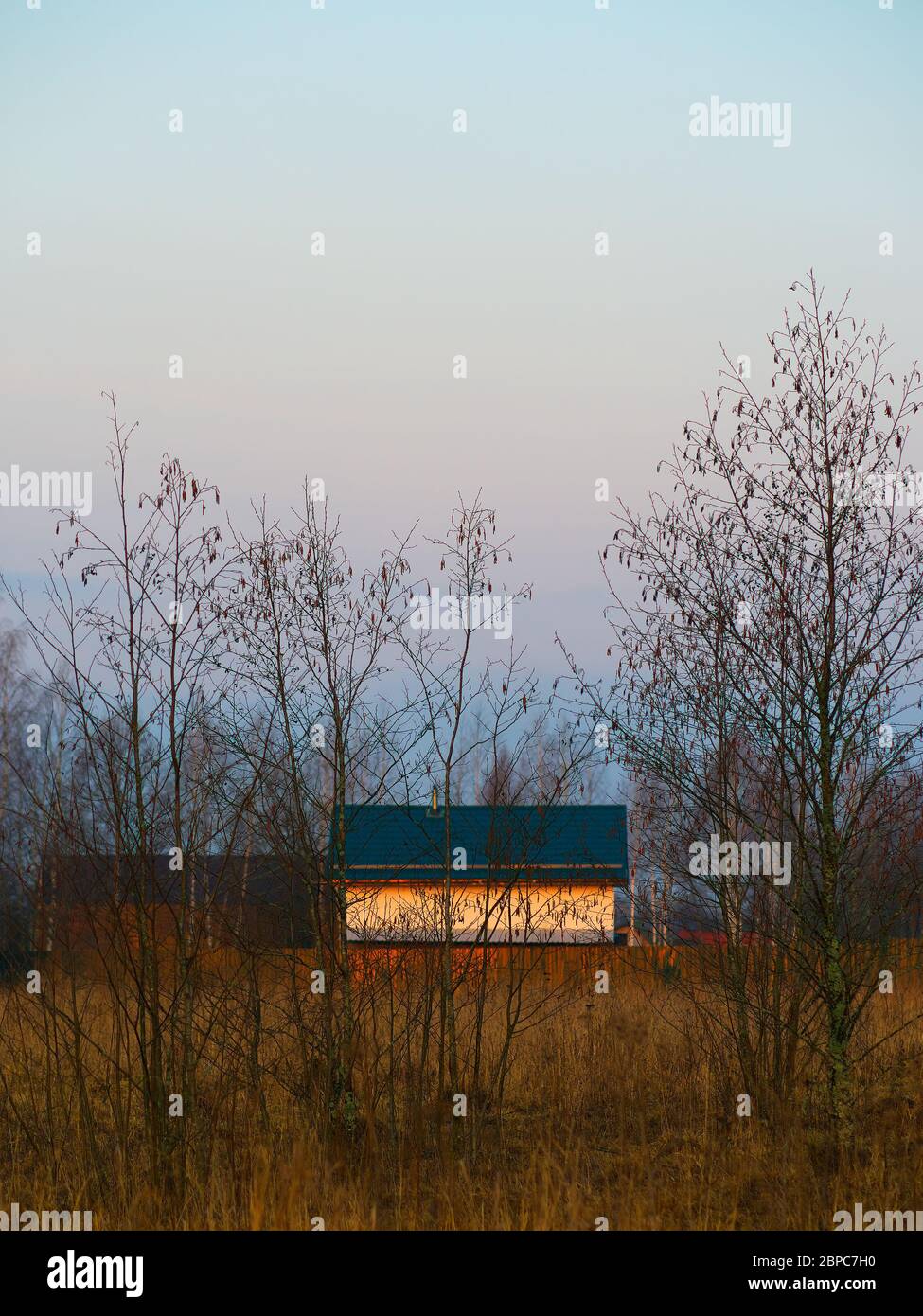 Farming house during dramatic sunset Stock Photo - Alamy