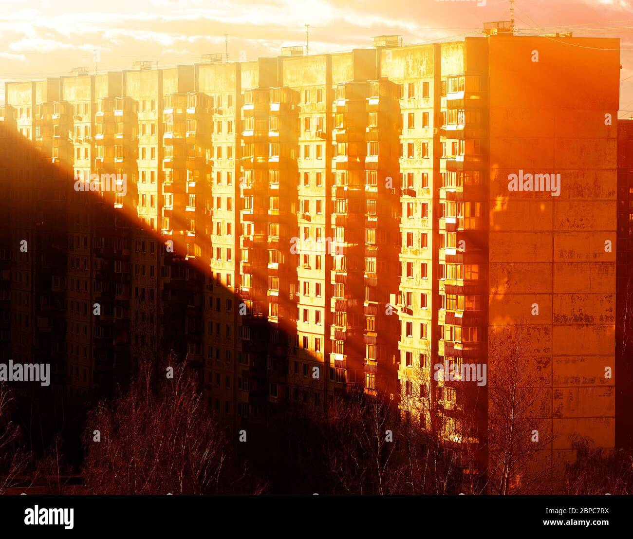 Dramatic light ray illuminating 80s buildings background Stock Photo ...