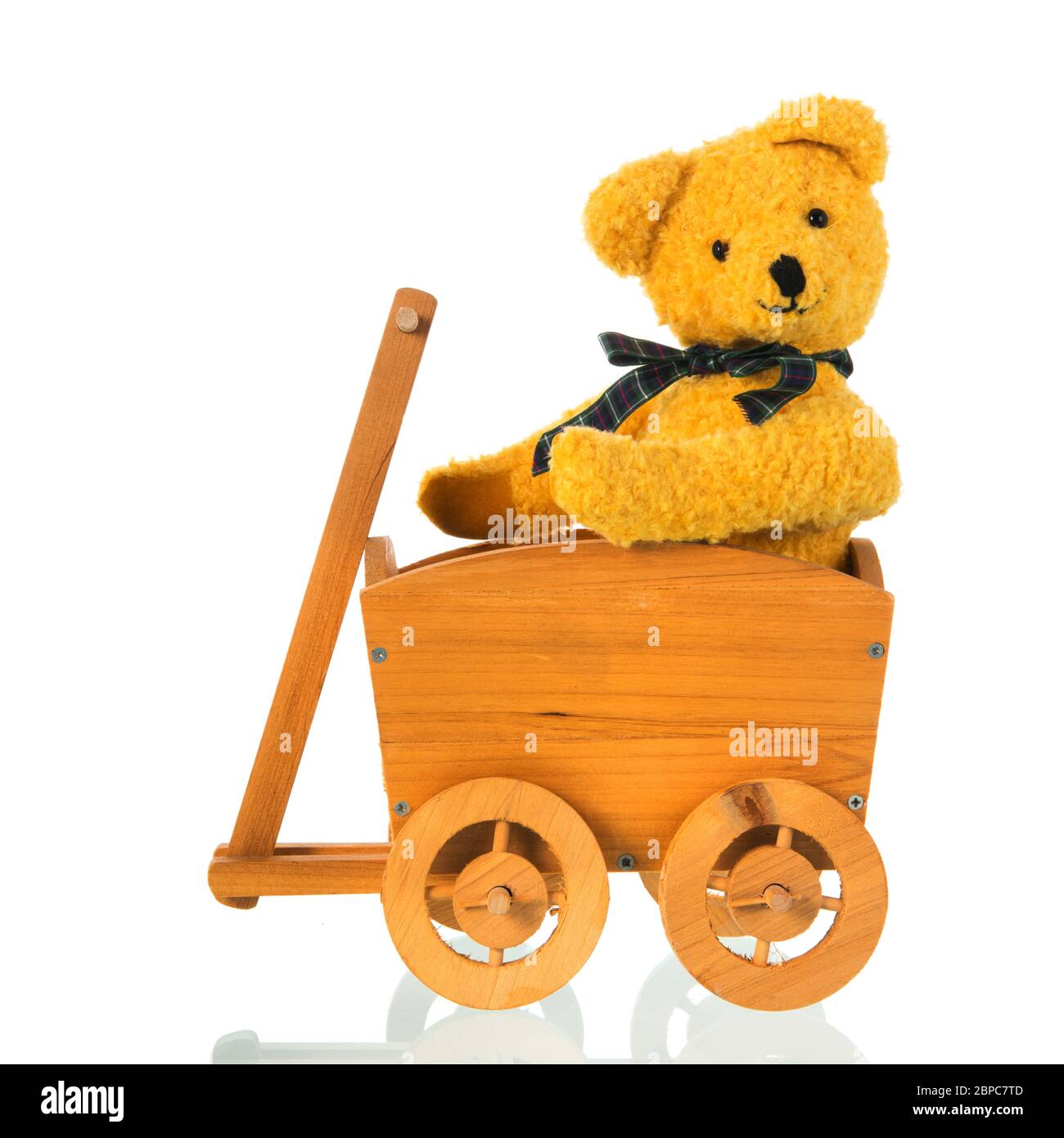 Stuffed bear toy sitting in cart isolated over white background Stock ...