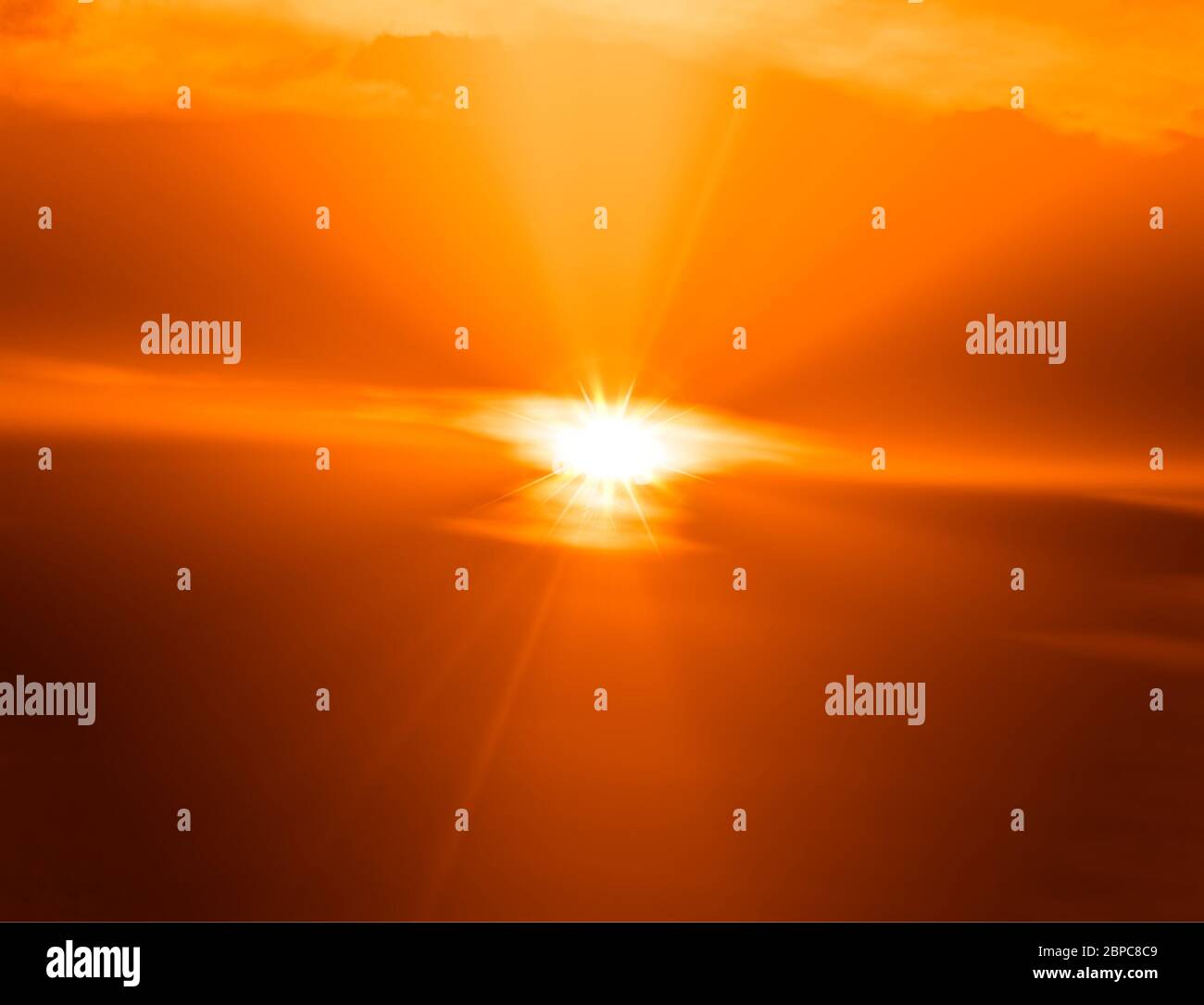 Dramatic God rays during burning sunset background Stock Photo - Alamy