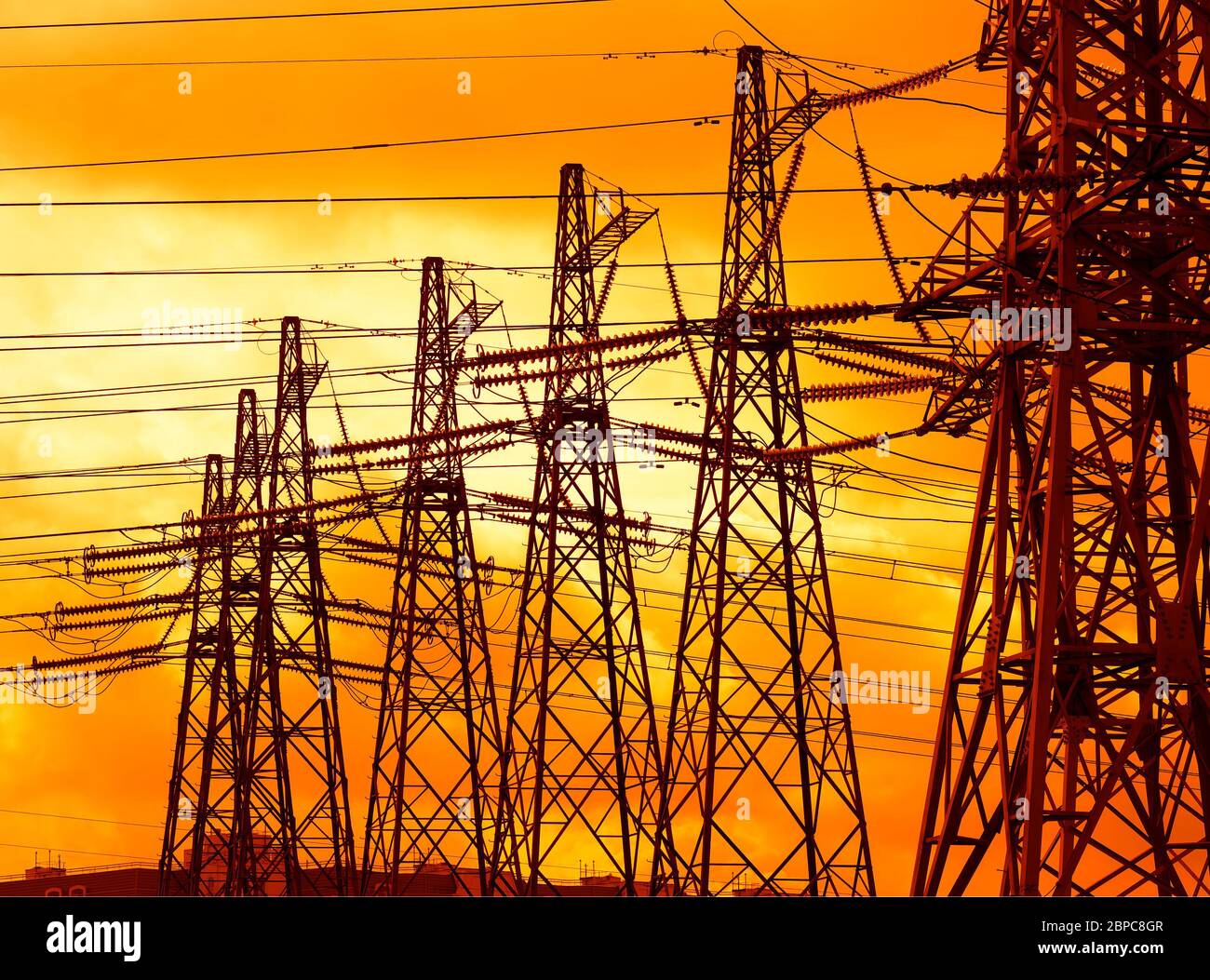 Dramatic industrial power lines background Stock Photo - Alamy
