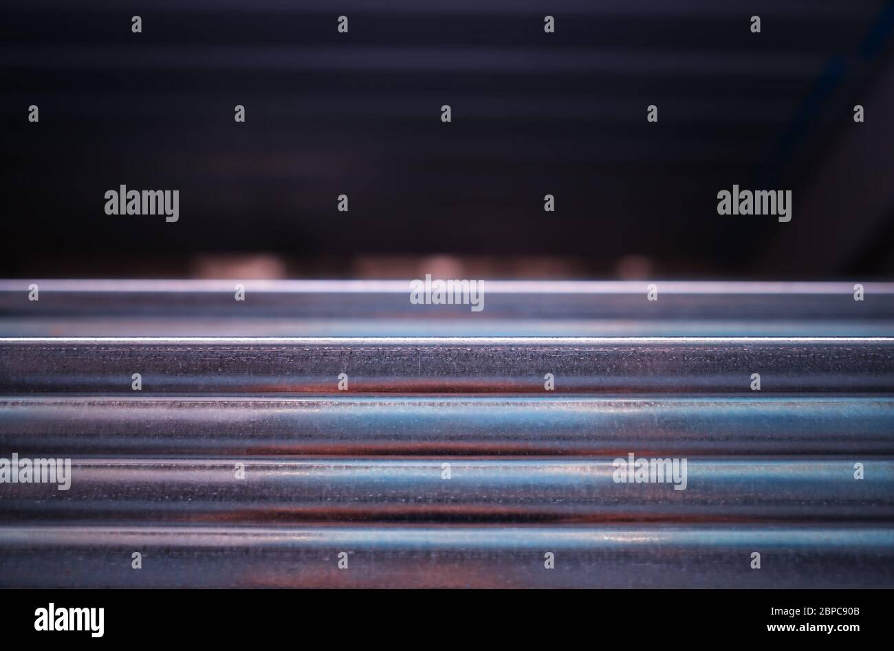 Steel materials at warehouse texture bokeh background Stock Photo - Alamy