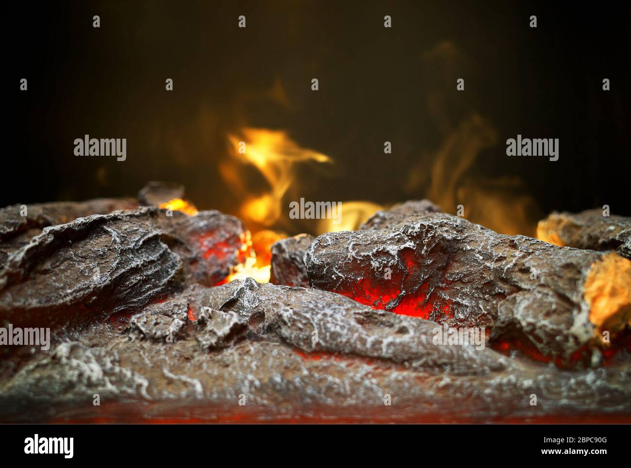 Burning fireplace interior background Stock Photo - Alamy