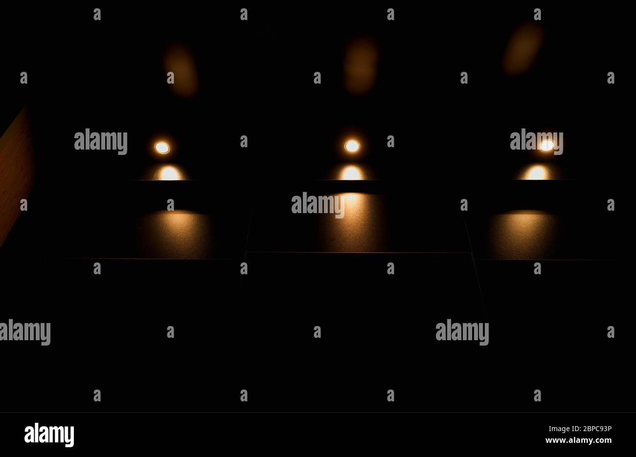 Three bright led lamps interior background Stock Photo - Alamy