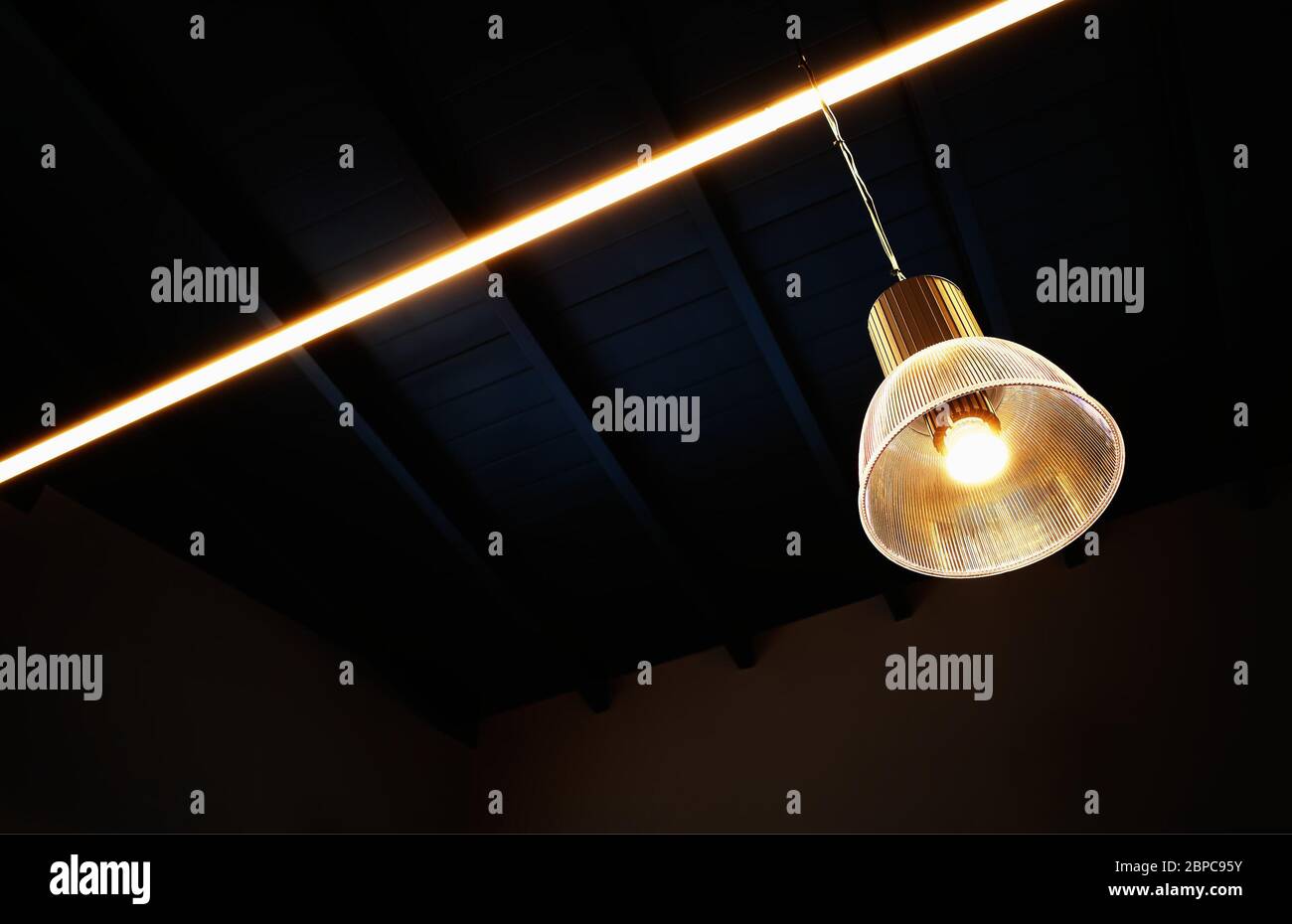 Glowing cafe lamp interior background Stock Photo - Alamy