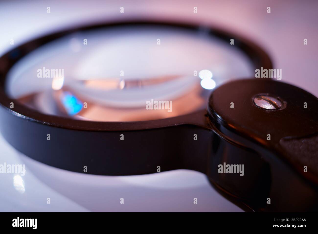 Magnifying glass in detail object background Stock Photo - Alamy