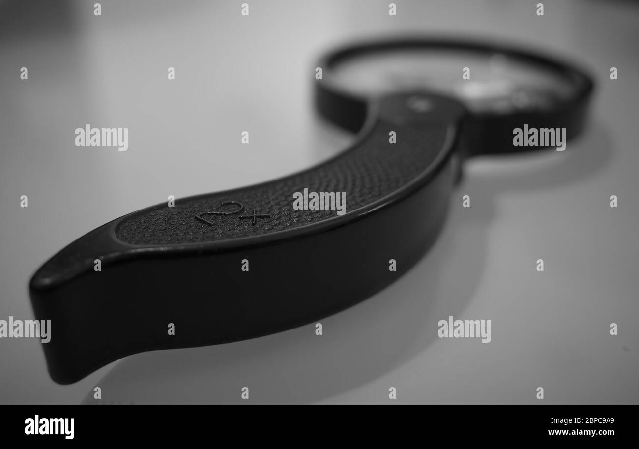 Magnifying glass in detail object background Stock Photo - Alamy