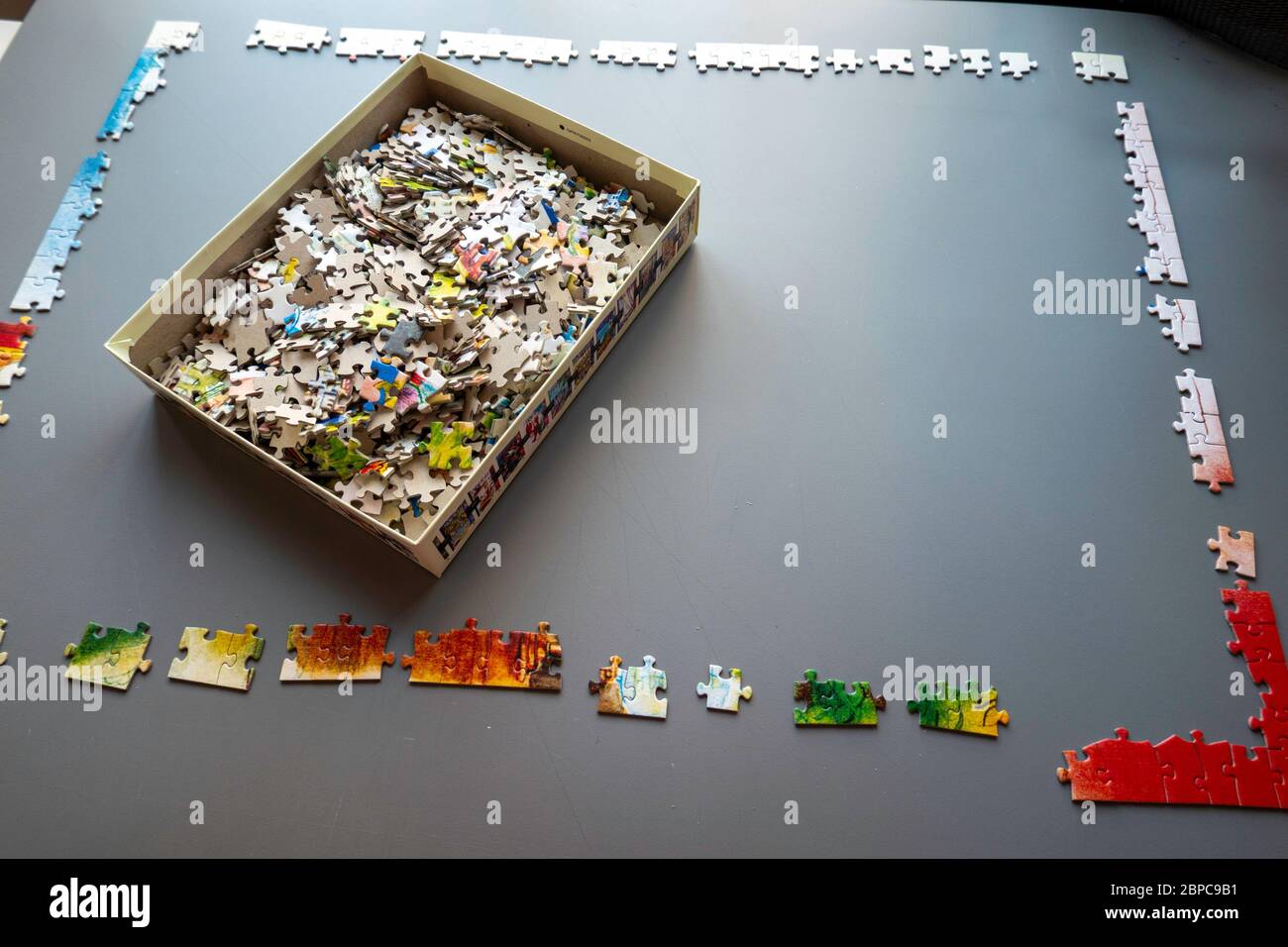 Jigsaw puzzle pieces in progress hi-res stock photography and images ...